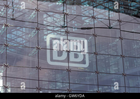 German railway logo "DB" (Deutsche Bahn) on glass facade of Berlin main ...