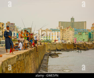 Man fishing in havana seawall ‚el malecón‘ in a cloudy day. Havana ...