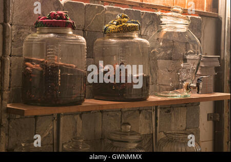 Jars of ya dong (Thai white spirits with medicinal herbs) at a bar in ...