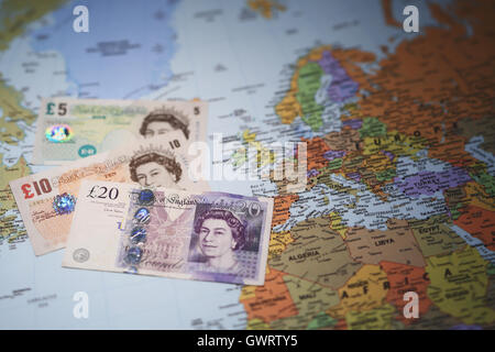 Pounds on world map Stock Photo - Alamy