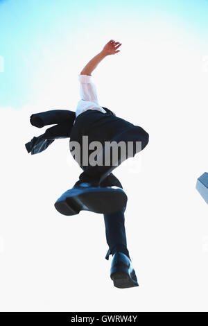 Japanese businessman jumping Stock Photo - Alamy