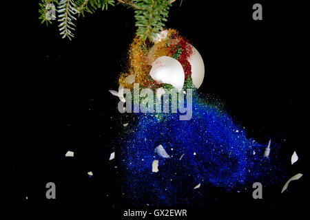 Christmas ball exploding. Glitters falling down Stock Photo - Alamy