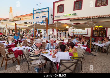 Cafés and restaurants in the square at Ferragudo, Algarve, Portugal ...