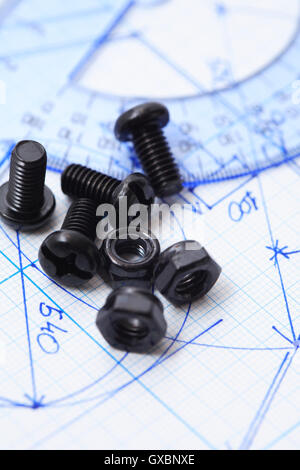 Screw, Nuts on graph paper background Stock Photo - Alamy