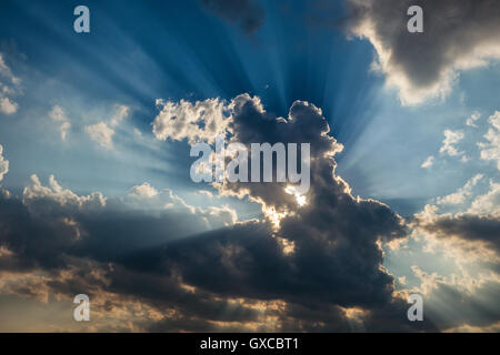 Sun rays through clouds like an dramatic explosion , power nature ...