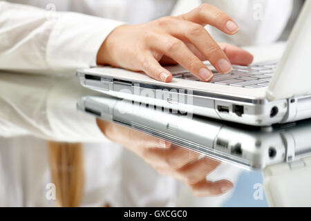 Closeup of businesswoman hand typing on keyboard with mouse on w Stock ...