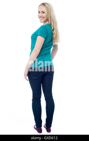 Attractive female turning back and smiling at you Stock Photo - Alamy
