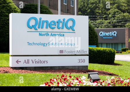 A logo sign outside of the headquarters of QinetiQ North America in ...