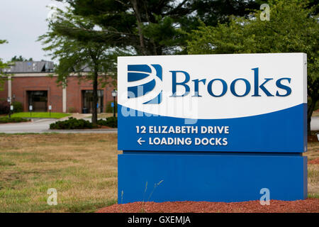 A logo sign outside of the headquarters of Brooks Automation in ...
