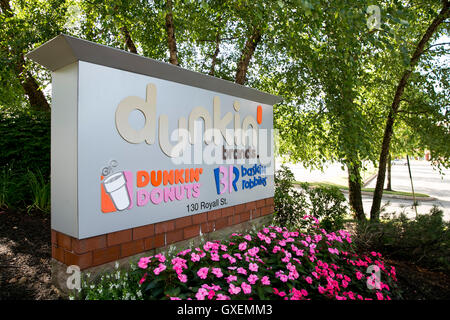 A logo sign outside of the headquarters of Dunkin' Brands Group, Inc ...