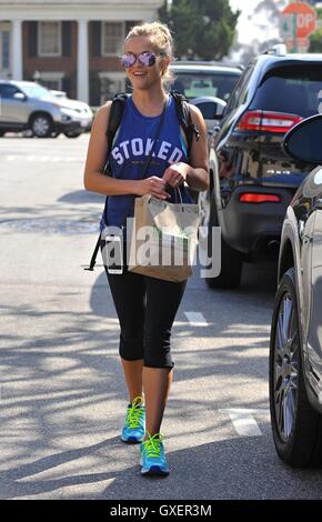 Reese Witherspoon drinks a healthy green juice as she leaves an ...