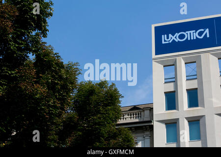 A logo sign outside of the headquarters of the Luxottica Group S.p.A ...