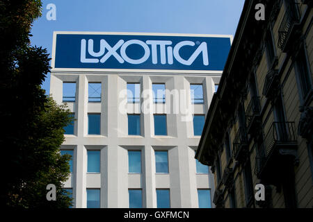 A logo sign outside of the headquarters of the Luxottica Group S.p.A ...