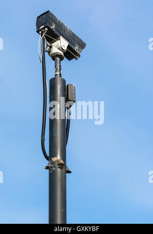 Security CCTV camera on a pole with sunset sky Stock Photo - Alamy