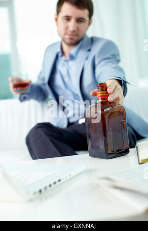 Businessman drinking alcohol Stock Photo - Alamy