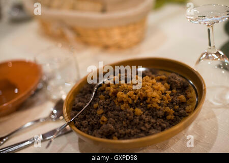 A ceramic bowl of cooked buckwheat porridge, or kasha, isolated on a ...
