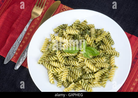 Traditional Italian pasta Fusili served with pesto sauce Stock Photo ...