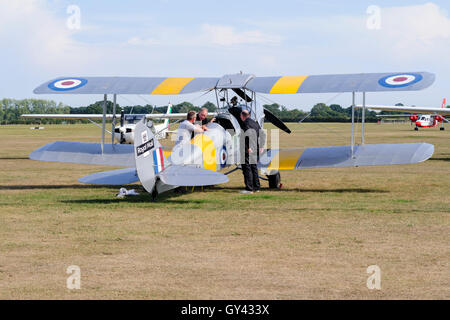 preparing a vintage tiger moth aircraft at headcorn airfield in kent ...