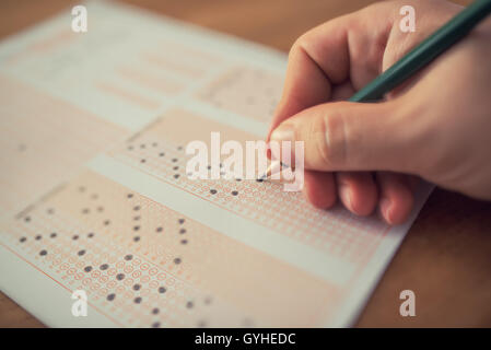 hand fill in Exam carbon paper computer sheet and pencil Stock Photo ...