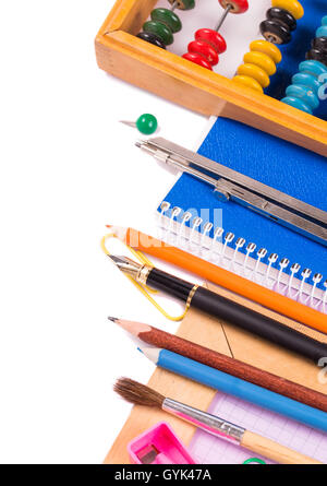 set of stationery objects: pen, paper clip, buttons and clip on a blue ...