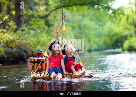 Kids playing on raft Stock Photo - Alamy