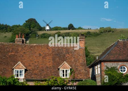 Turville Village showing the gravestones and Cobstone windmill in th ...
