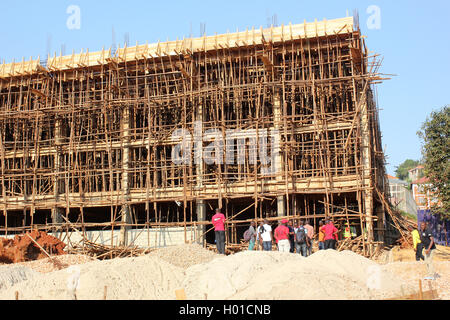 Workers constructing a sports stadium in Wakiso district in Uganda ...