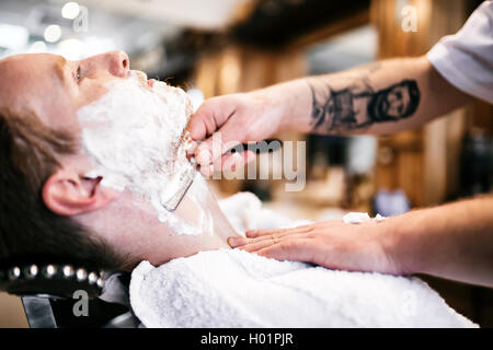 Retro shaving with foam in barber shop Stock Photo - Alamy