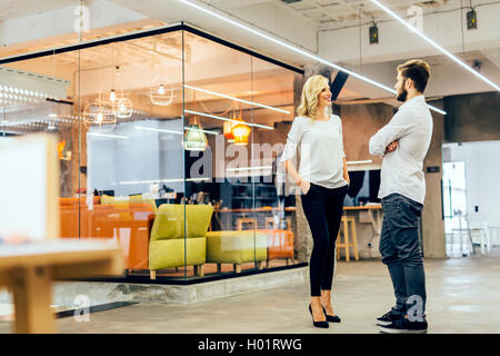 Conversation between two colleagues or business partners sitting Stock ...