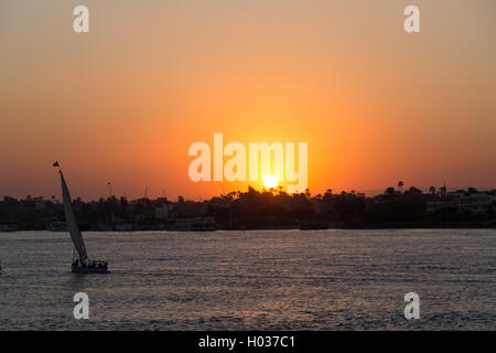 Tourist boat at Luxor waterfront during sunset Stock Photo - Alamy