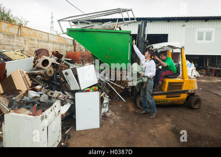 Poor Roma people (Gypsy) collecting garbage from refuse dump near town ...