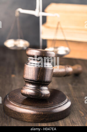 Wooden gavel and books on wooden table Stock Photo - Alamy