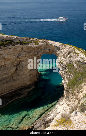 The Trypitos Arch, a limestone arch over the sea on Paxos, The Ionian ...