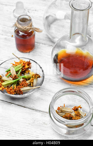 Medical extract decoction from the flowers of marigold Stock Photo - Alamy