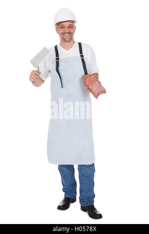 Portrait of smiling bricklayer Stock Photo - Alamy