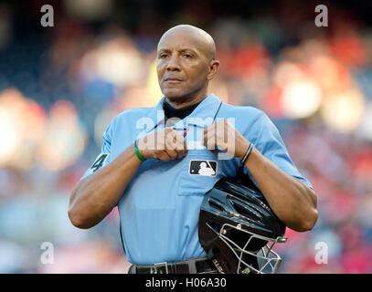 Home plate umpire CB Buckner (54) between innings of the game pitting ...