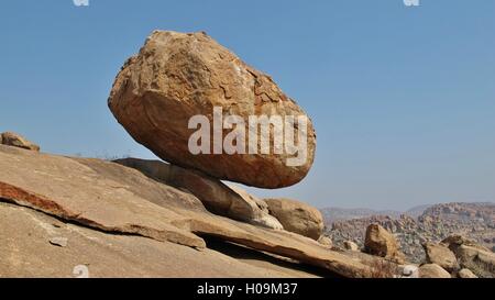 Big balancing granite boulder in Hampi, India. Popular area for ...