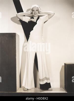 Beautiful woman in black t-shirt and red skirt and glasses walking in ...
