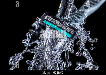 Disposable Razor with water splash Stock Photo - Alamy