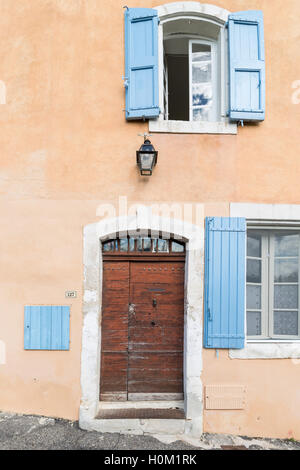 Typical French provence style windows with blue shutters and flower ...