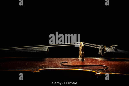 Details of an old and dusty violin from Czechoslovakia and tambourine ...