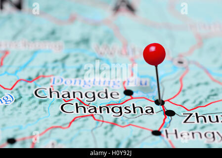 Close up to a Changsha city with a red pin needle into China country ...
