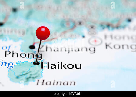 Close up to a Haikou city with a red pin needle into China country ...