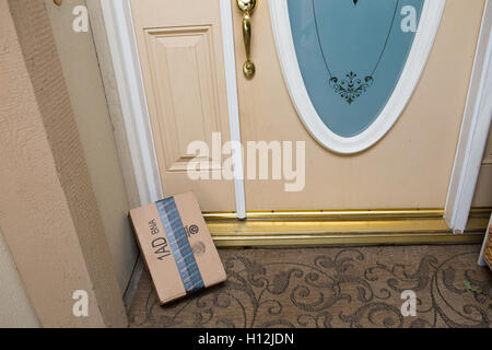 Amazon delivery box outside a residential homes front door Stock Photo ...