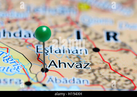 Close up to a Ahvaz city with a green pin needle into Iran country ...
