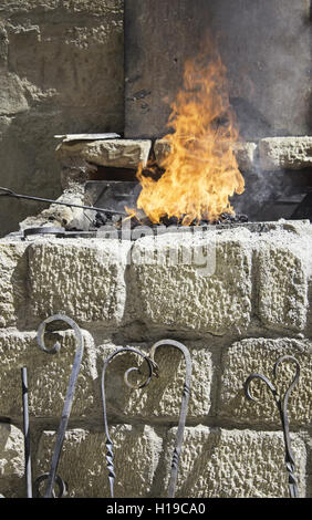 Blacksmith working with fire and embers, artisan Stock Photo - Alamy