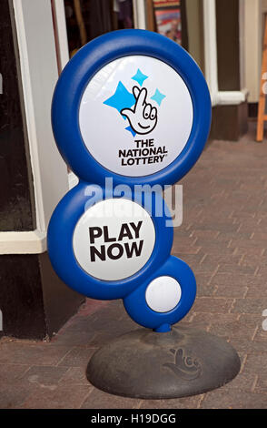 The National lottery "play here" sign outside a post office with ...
