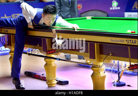 Mark Allen of Northern Ireland plays a shot to Ken Doherty of Ireland ...
