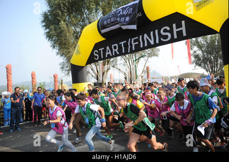 Zhenfeng, China's Guizhou Province. 23rd Sep, 2016. A couple run in the ...