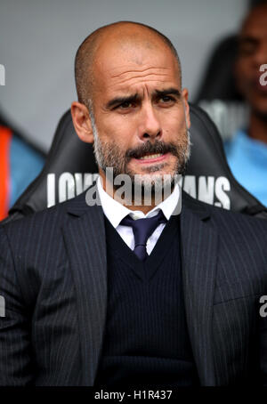 Manager of Manchester City Josep Pep Guardiola drinks from a bottle ...